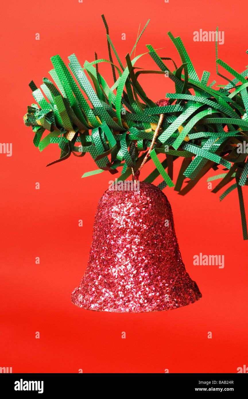 Red Christmas bell hanging on a Christmas tree Stock Photo - Alamy