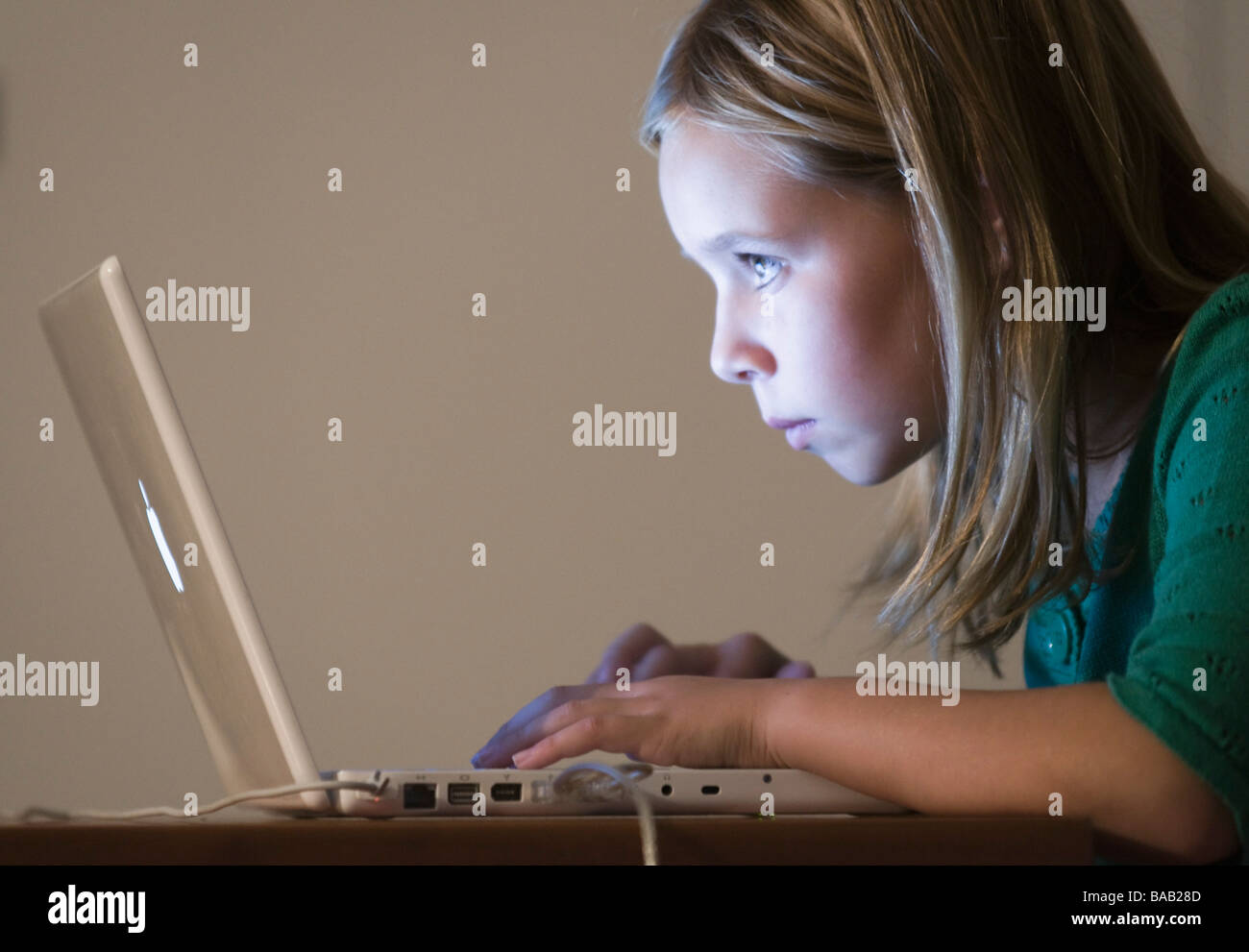 Young girl using computer Stock Photo - Alamy