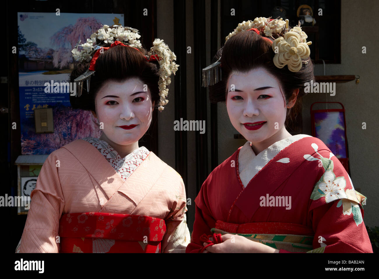 Two Maiko (trainee Geisha) pose for the camera in Kyoto, Kansai, Japan ...