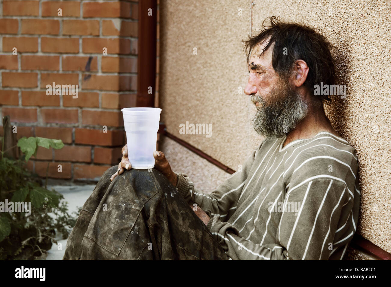 Homeless poor alcoholic Stock Photo - Alamy