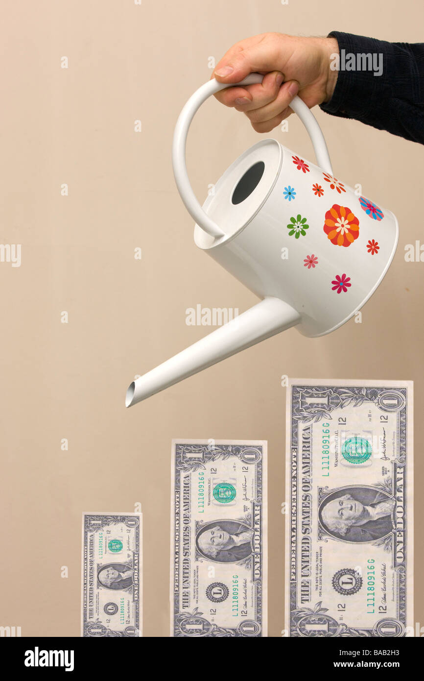 Making money grow Stock Photo - Alamy