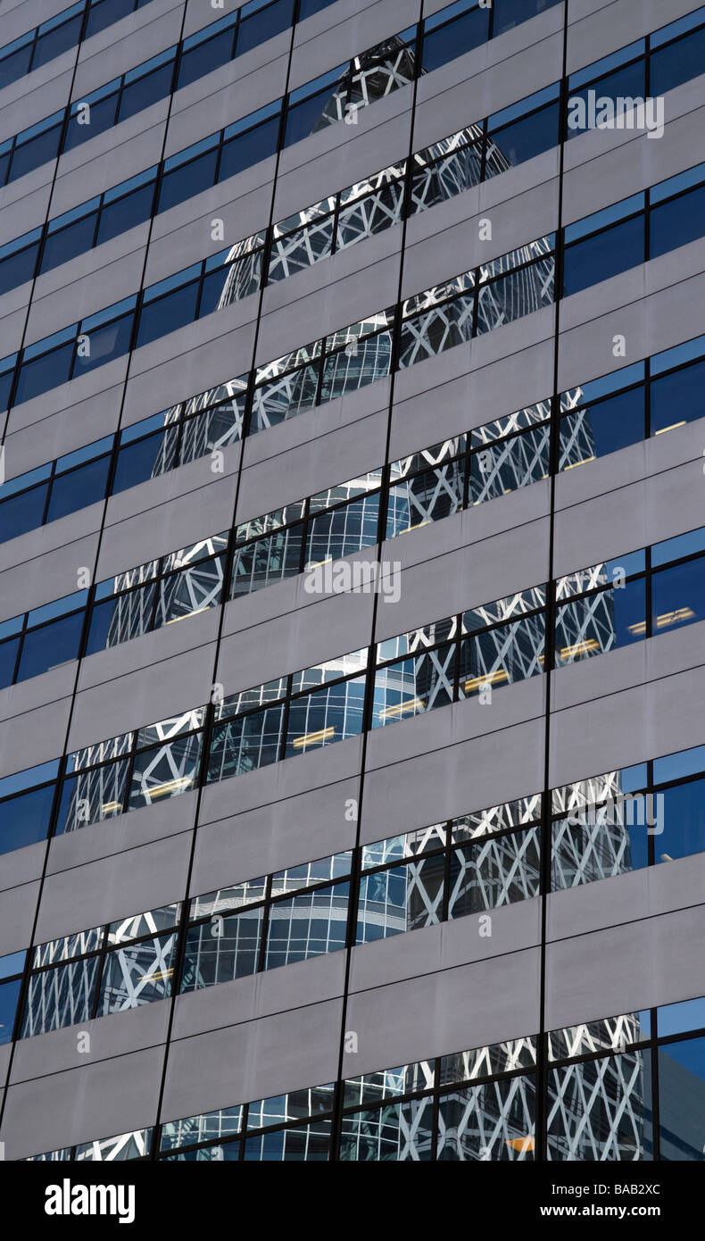 A reflection of The Mode Hal Iko building in Shinjuku, Tokyo, Japan ...