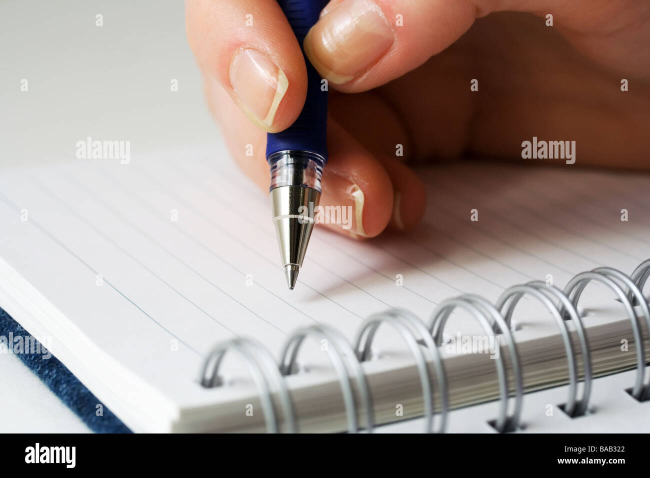 Female hand writing Stock Photo - Alamy