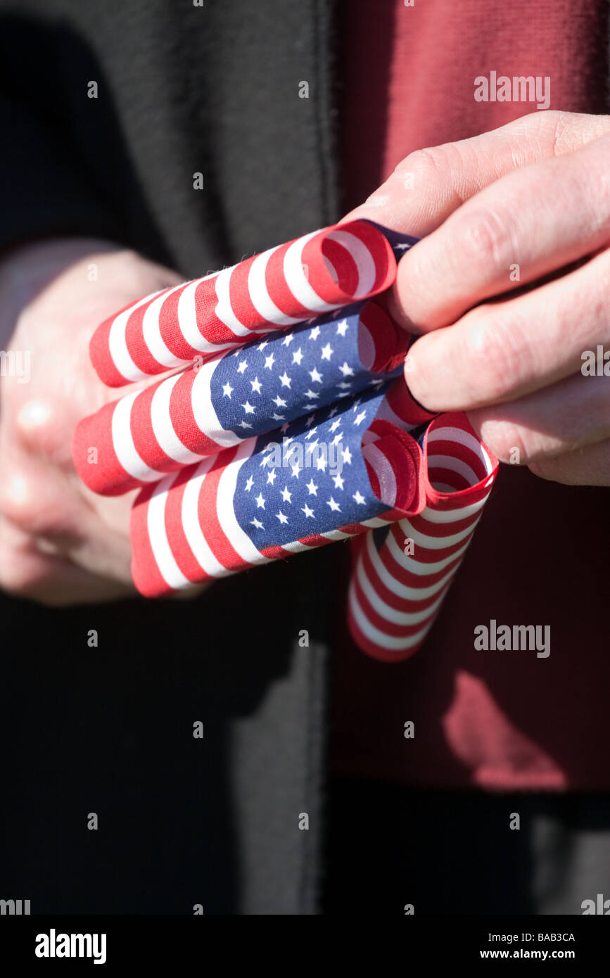 Hold small flags hi-res stock photography and images - Alamy