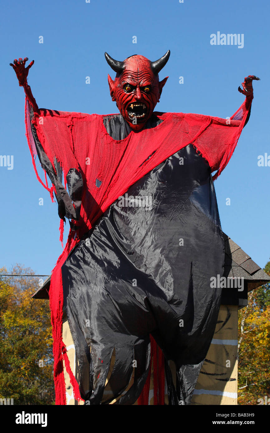 Halloween spooky scary face of red devil mask dummy dressed in Autumn ...