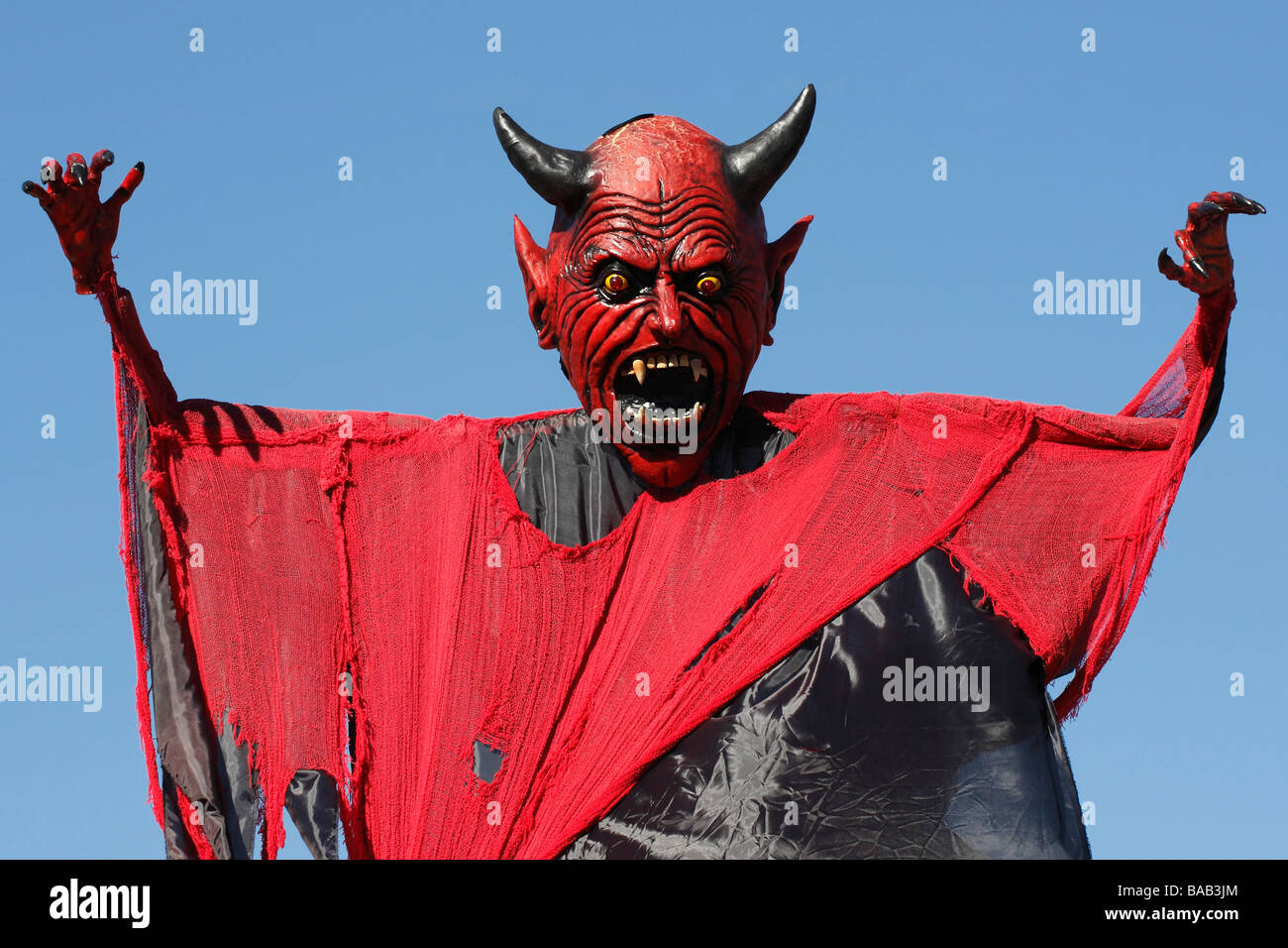 Halloween spooky scary face of red devil mask dummy dressed in Autumn ...