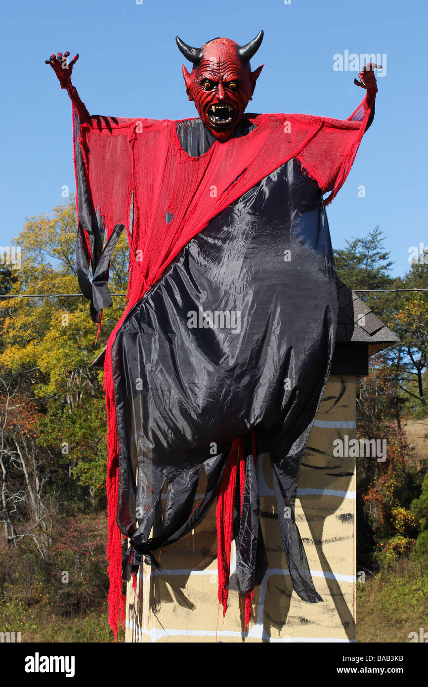 Halloween spooky scary face of red devil mask dummy dressed in Autumn ...