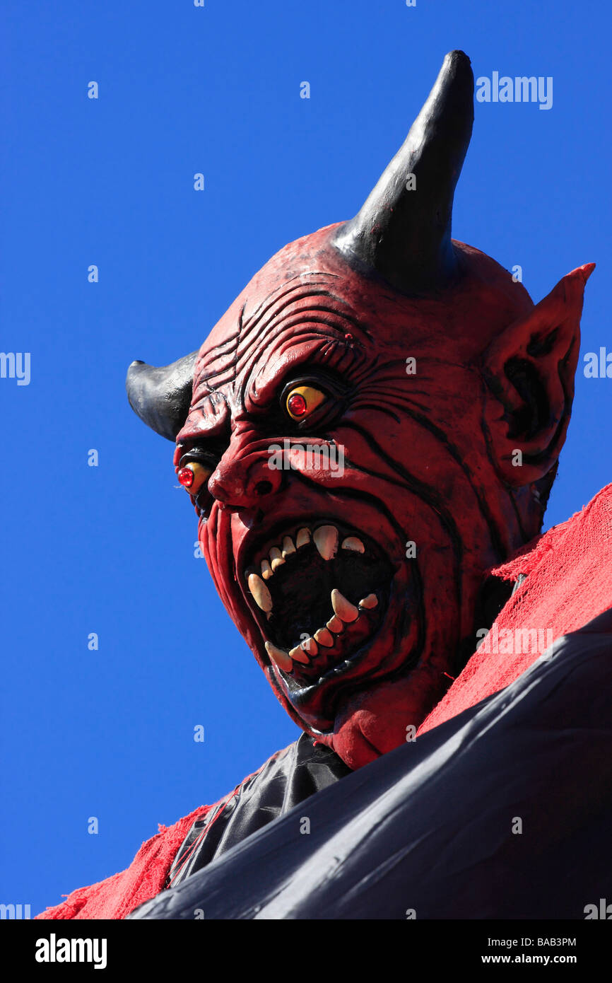 Halloween spooky scary face of red devil mask dummy dressed in Autumn ...