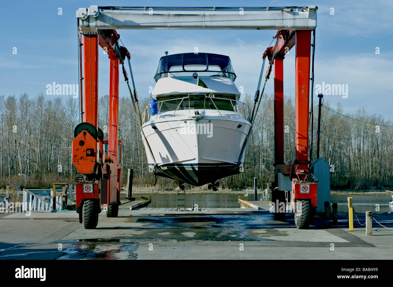 Pleasure boat on boat sling Stock Photo - Alamy