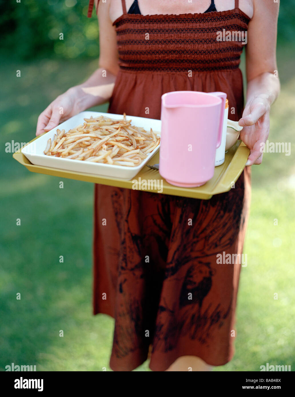 A Woman Carrying A Tray Sweden Stock Photo - Alamy