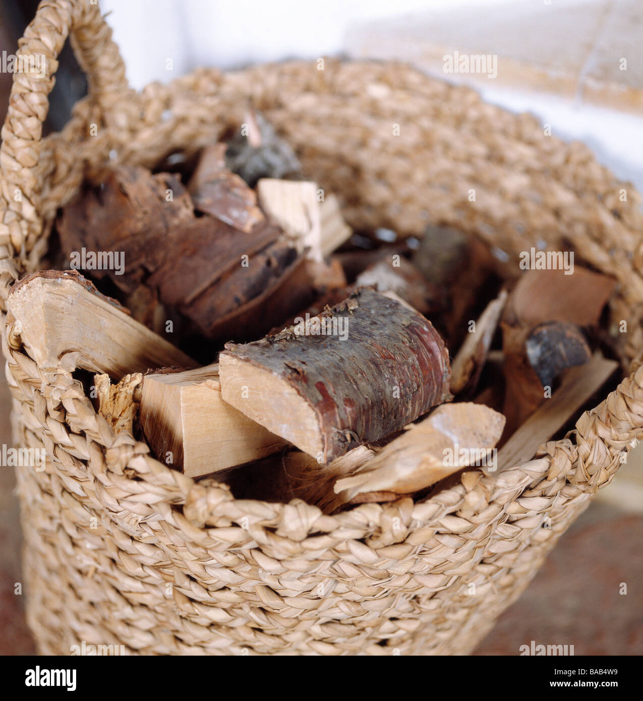 Fire Wood In A Basket Stock Photo - Alamy