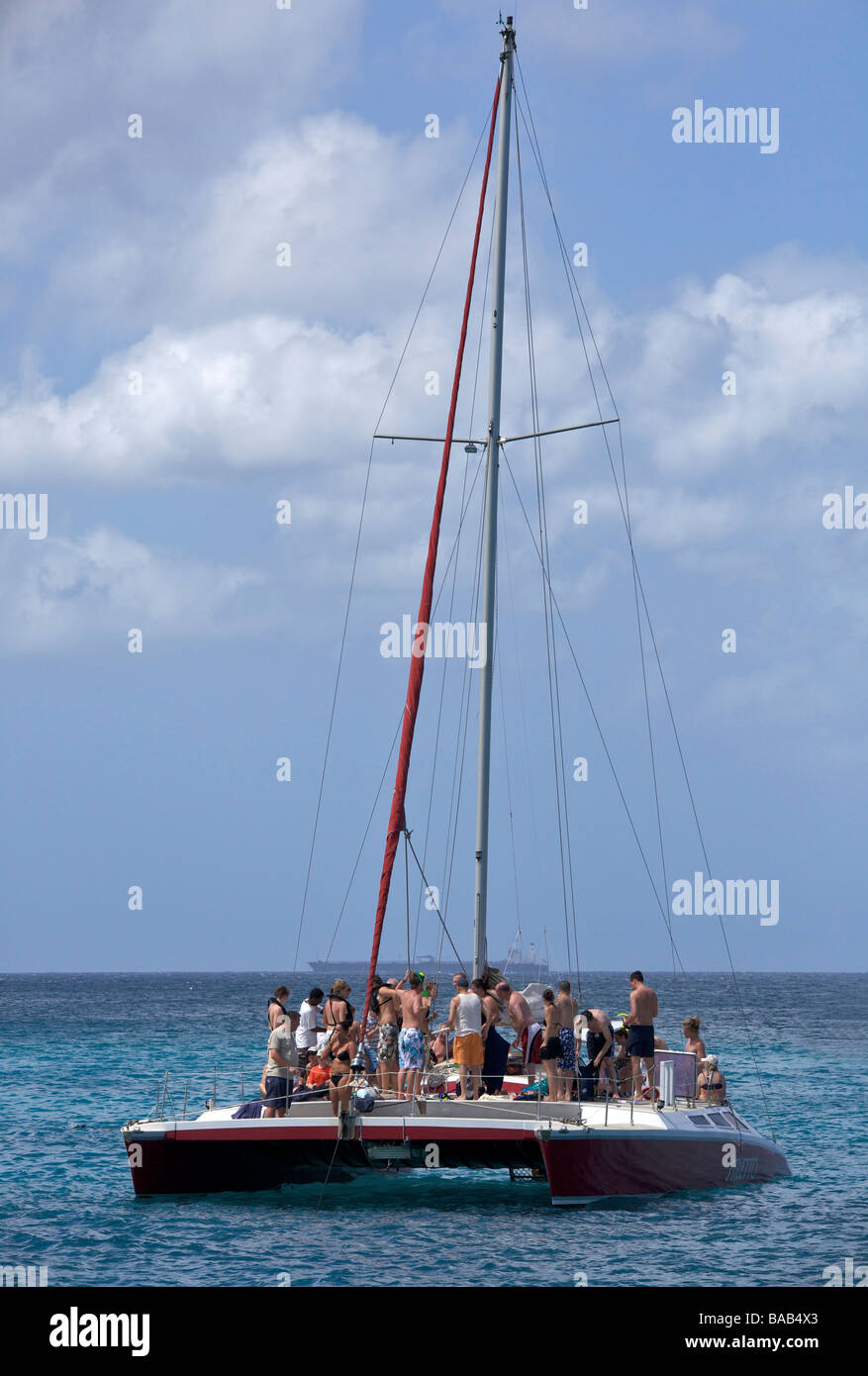 Tourists enjoying the sunshine on a catamaran cruise, West Coast of ...