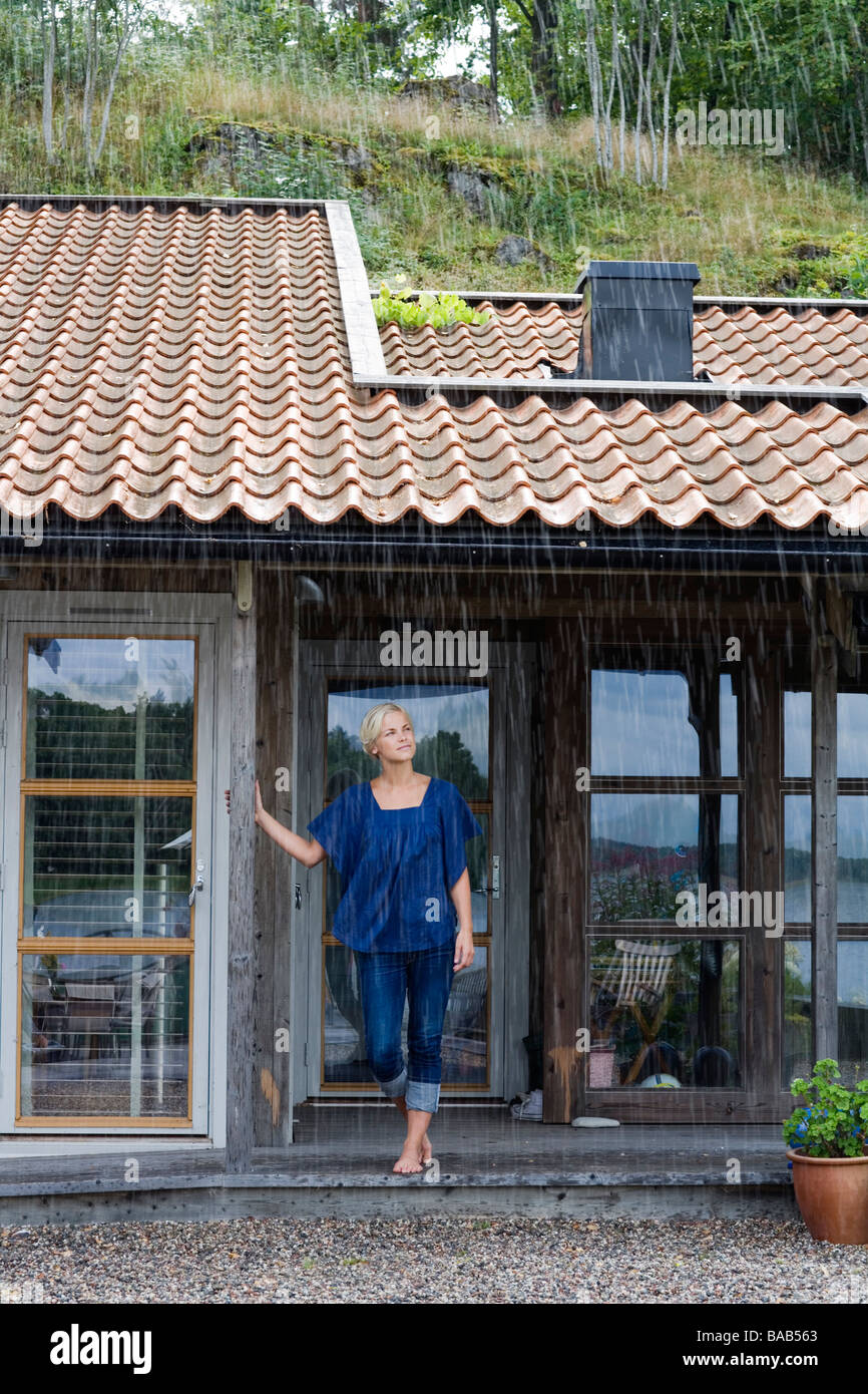 A woman enjoying the rain, Sweden Stock Photo - Alamy