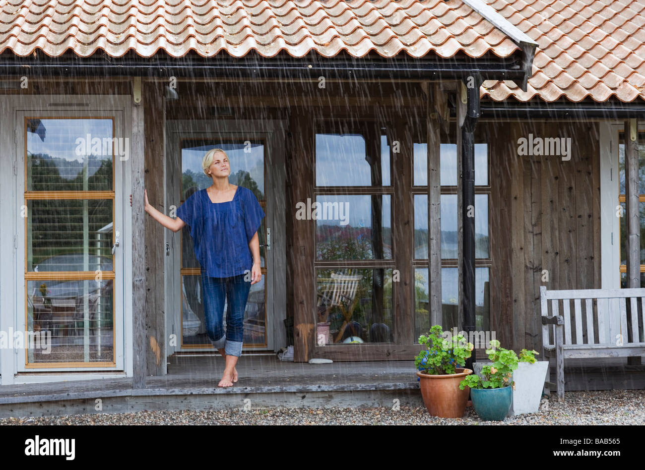A woman enjoying the rain, Sweden Stock Photo - Alamy