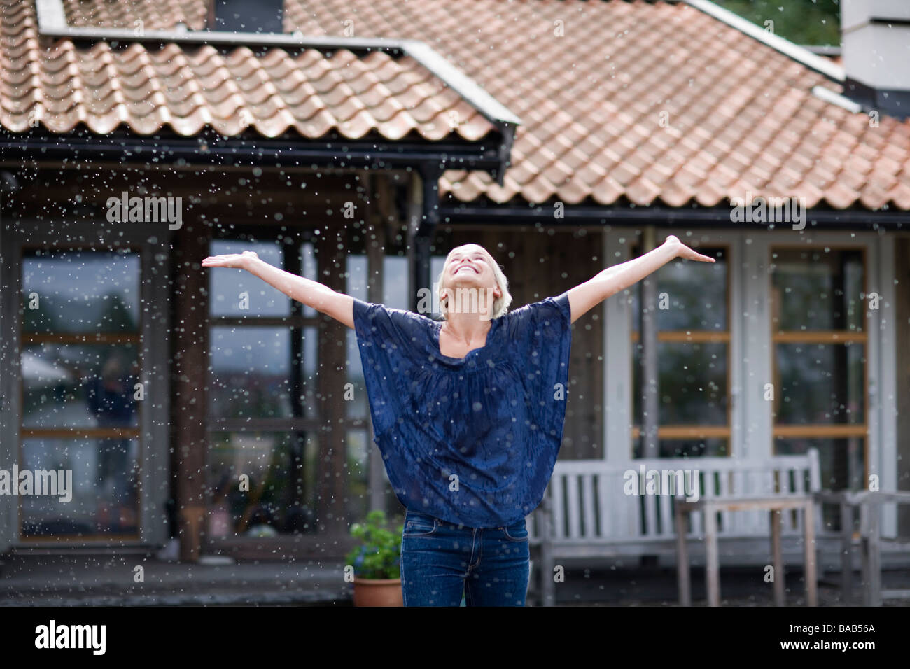 A woman enjoying the rain, Sweden Stock Photo - Alamy
