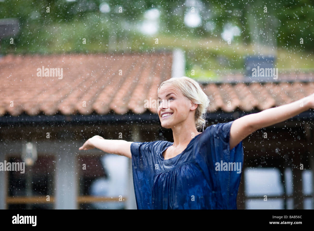 A woman enjoying the rain, Sweden Stock Photo - Alamy