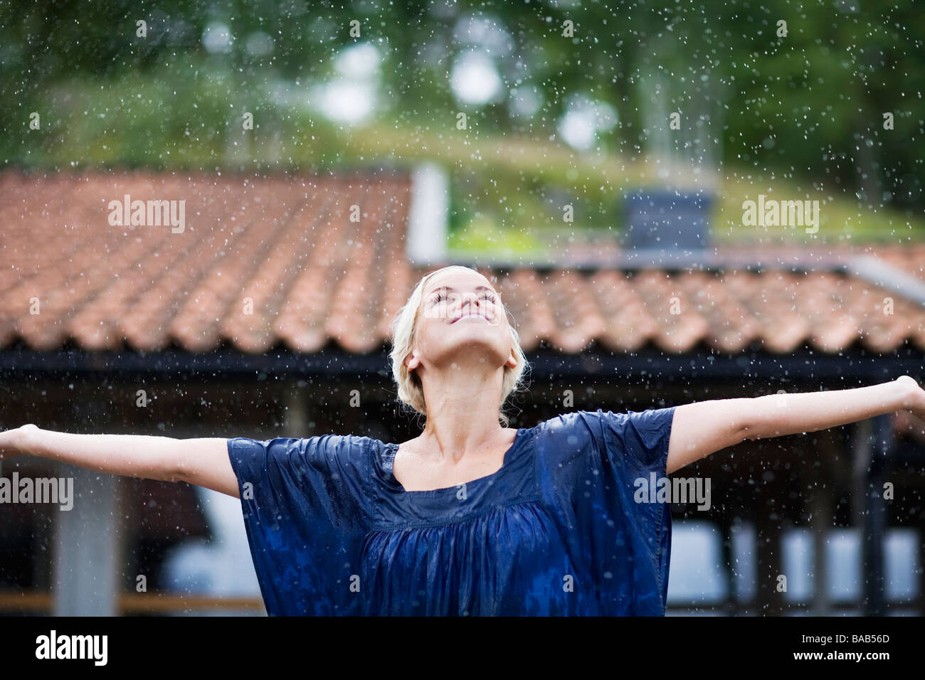 A woman enjoying the rain, Sweden Stock Photo - Alamy