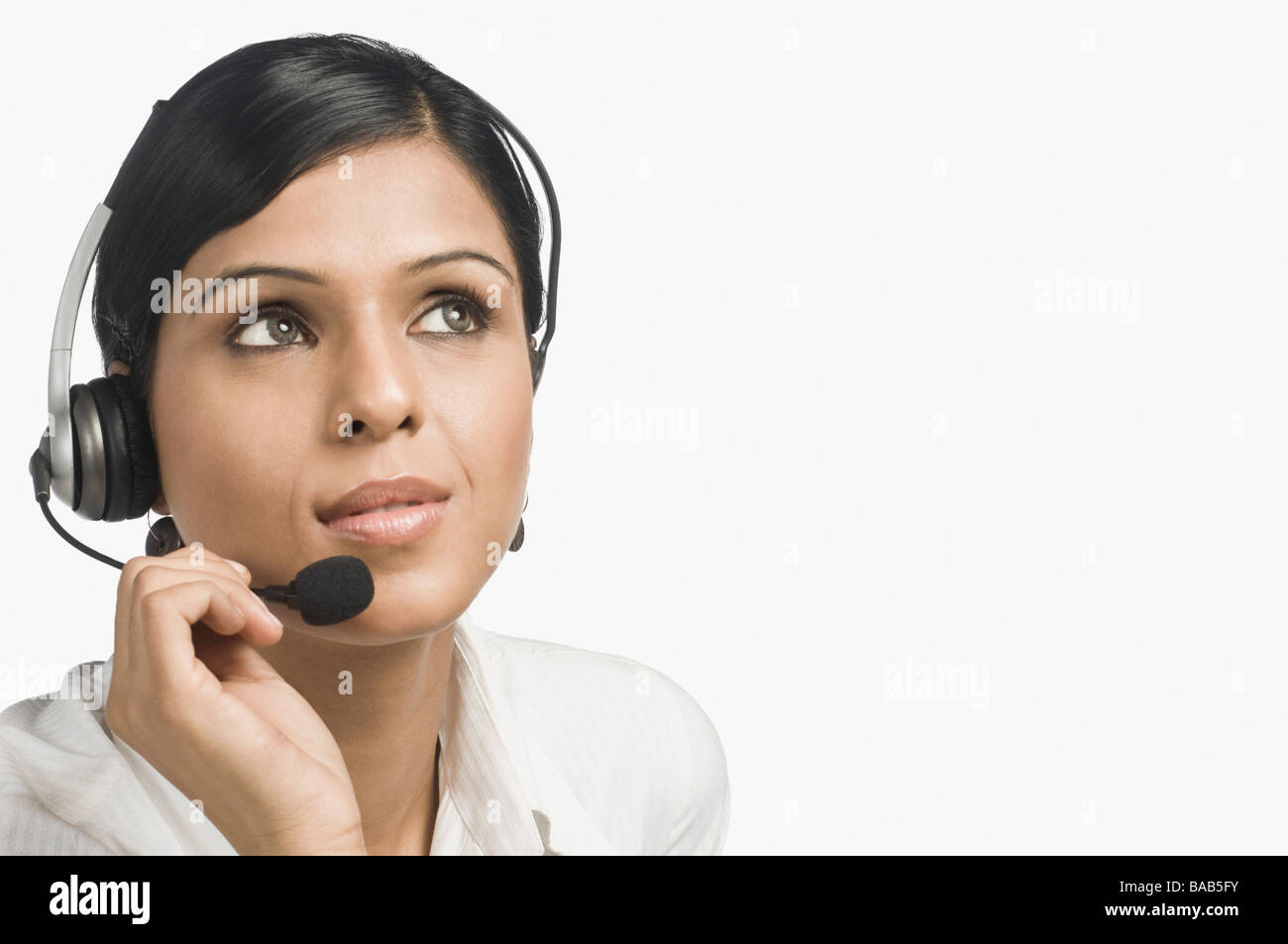 Close-up of a female customer service representative thinking Stock ...