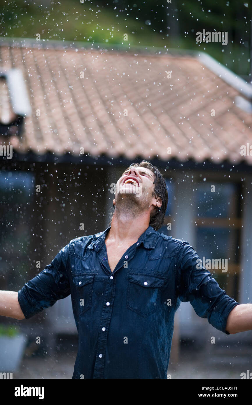 A man enjoying the rain, Sweden Stock Photo - Alamy
