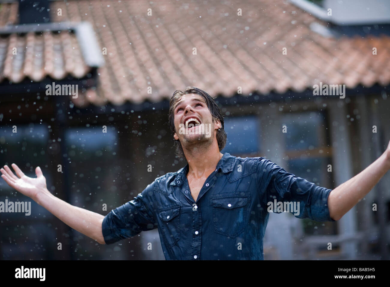 A man enjoying the rain, Sweden Stock Photo - Alamy