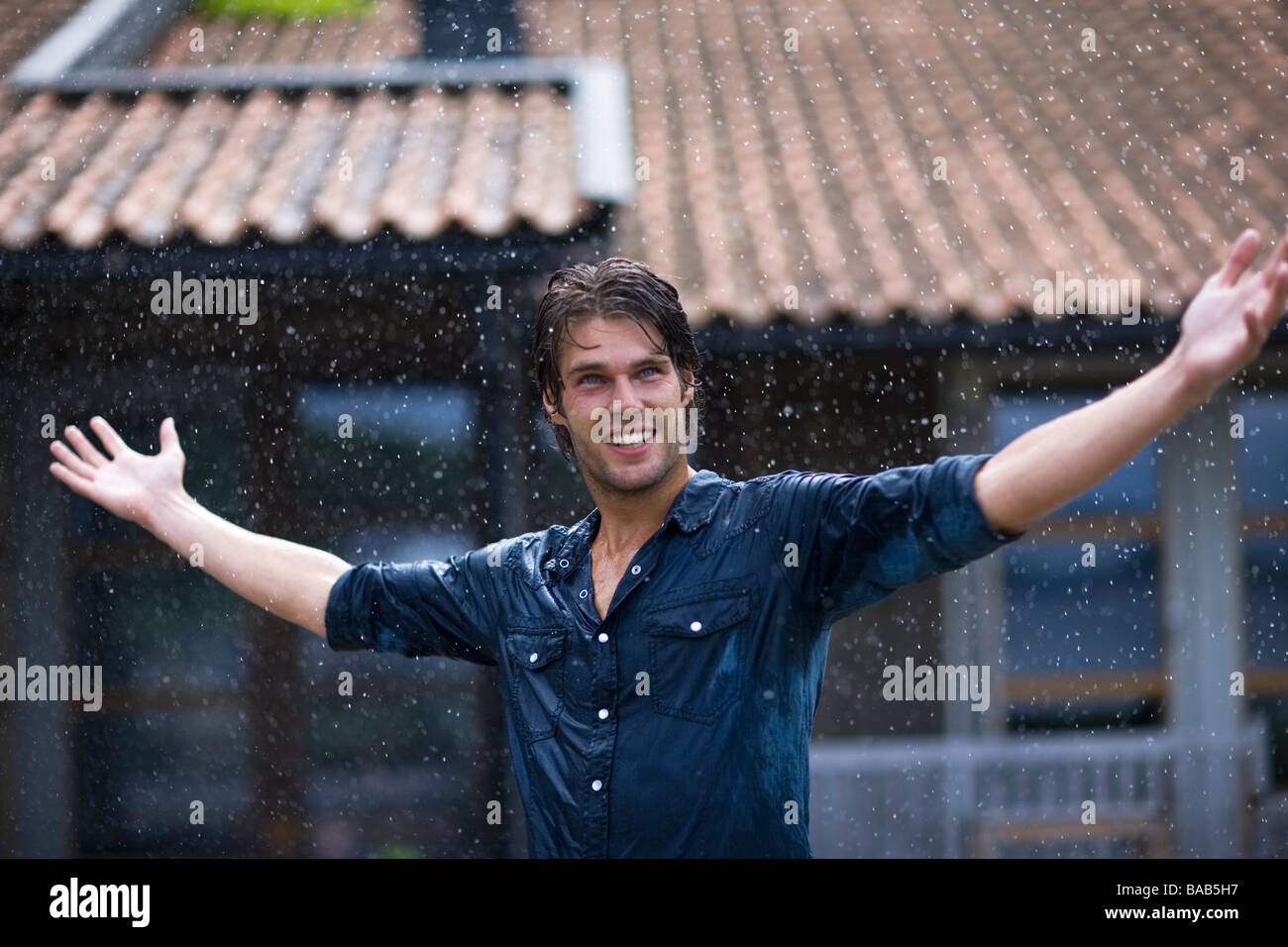 A man enjoying the rain, Sweden Stock Photo - Alamy