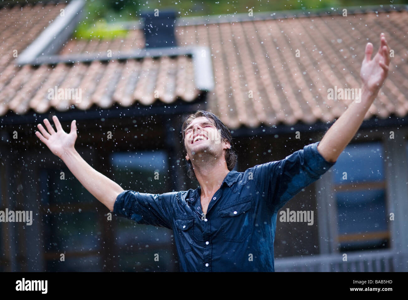 A man enjoying the rain, Sweden Stock Photo - Alamy
