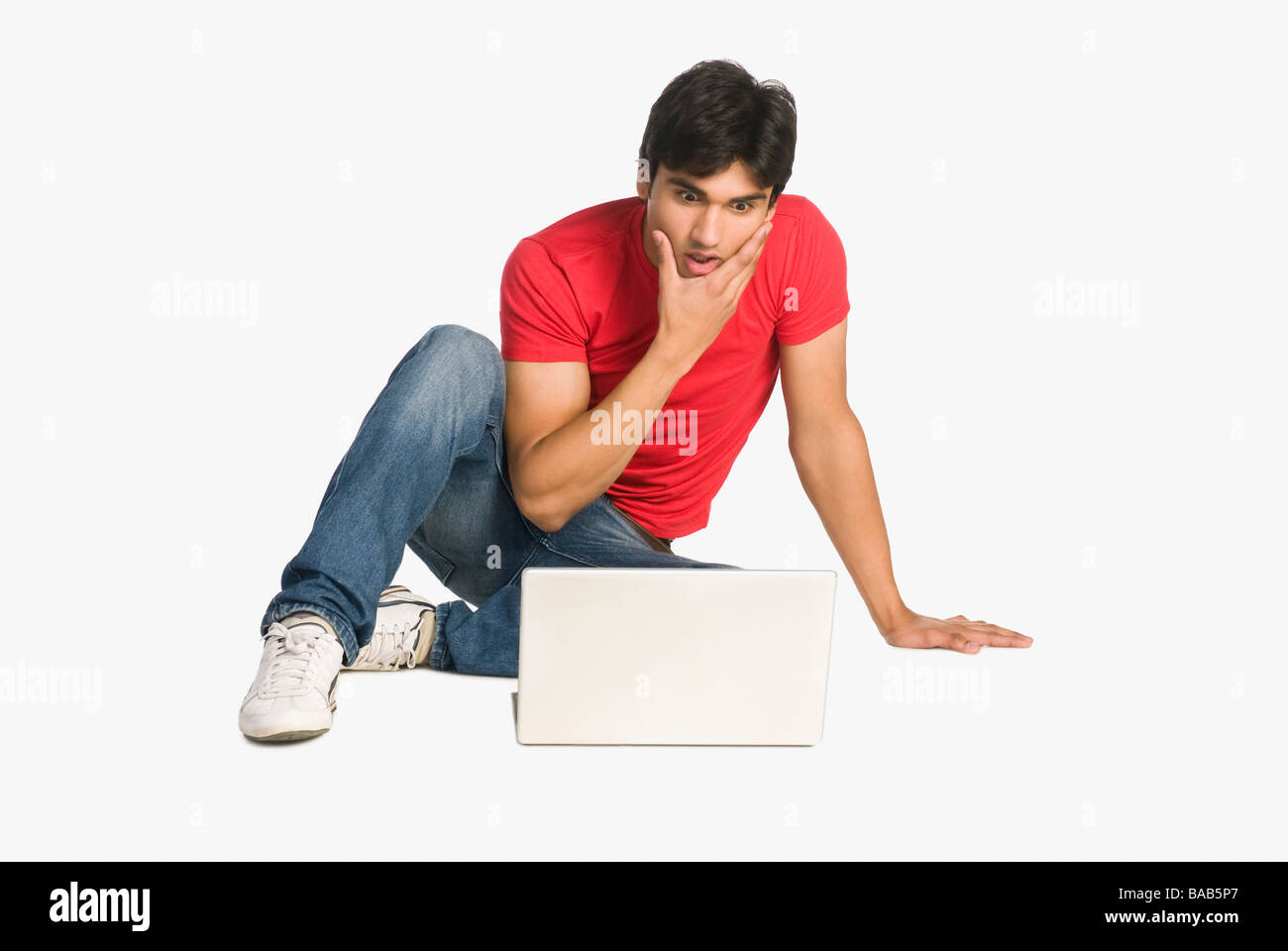 Amazed man red shirt Cut Out Stock Images & Pictures - Alamy