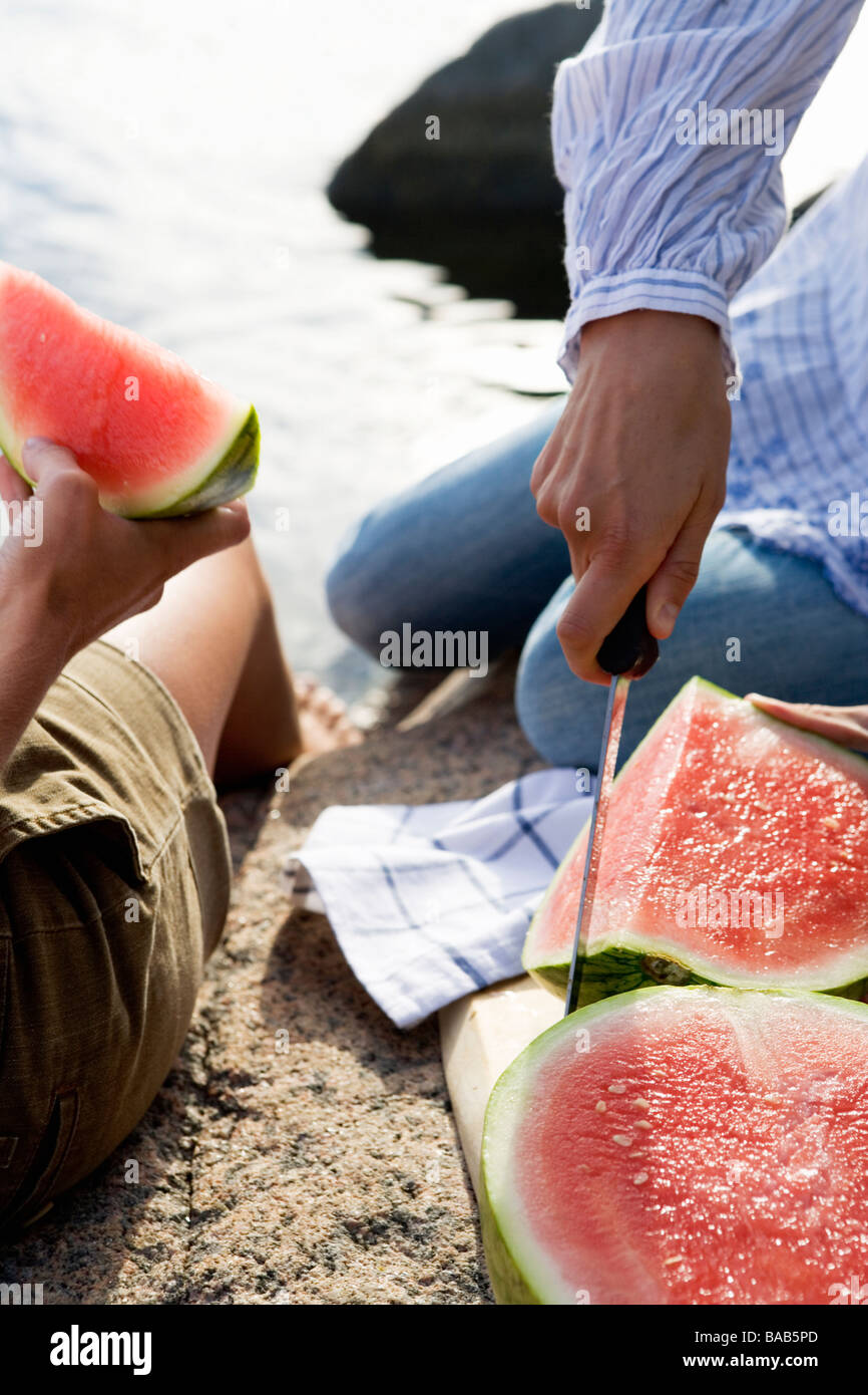 A woman cutting up a watermelon, Sweden Stock Photo - Alamy