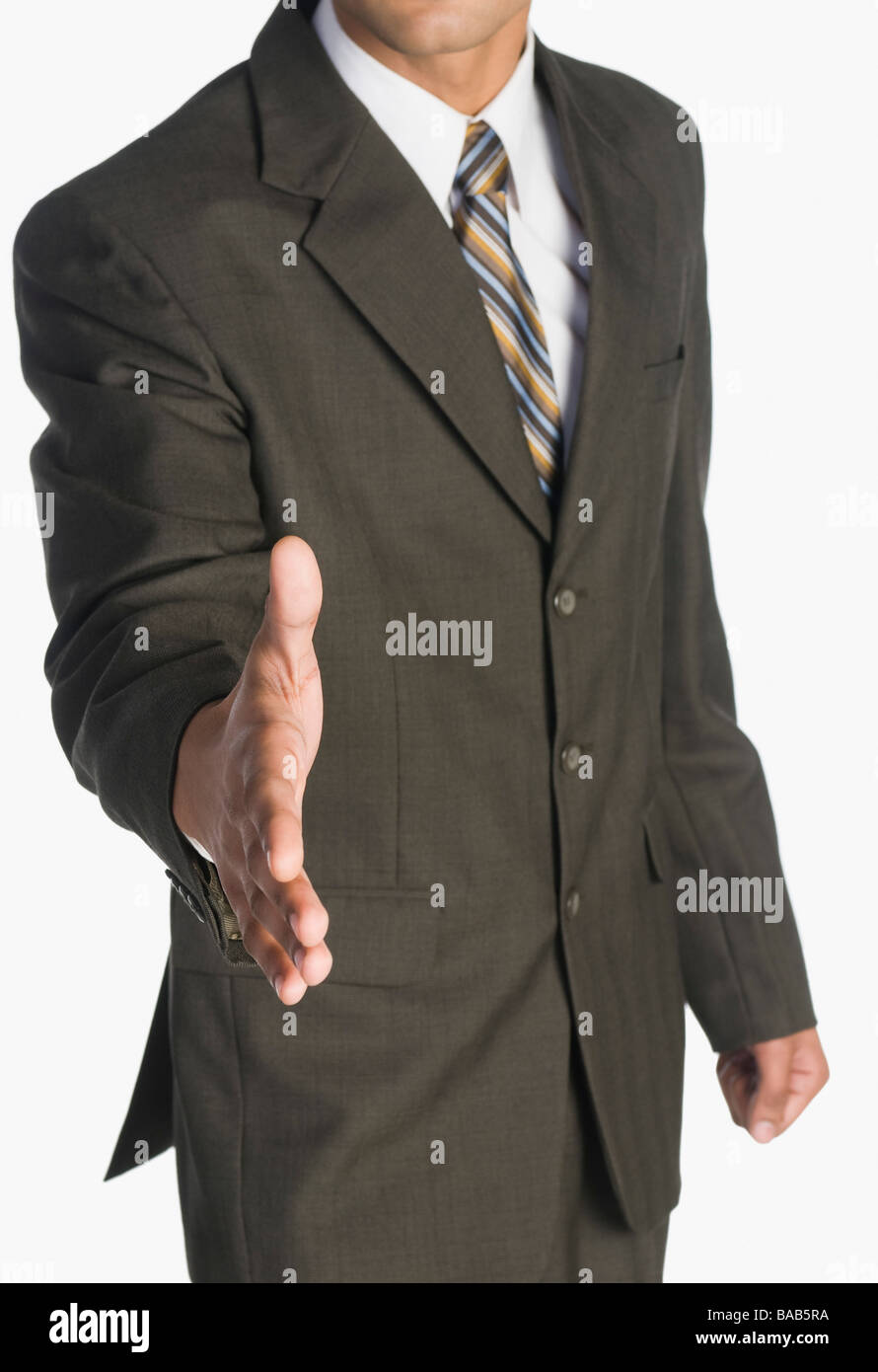Businessman offering a handshake Stock Photo - Alamy