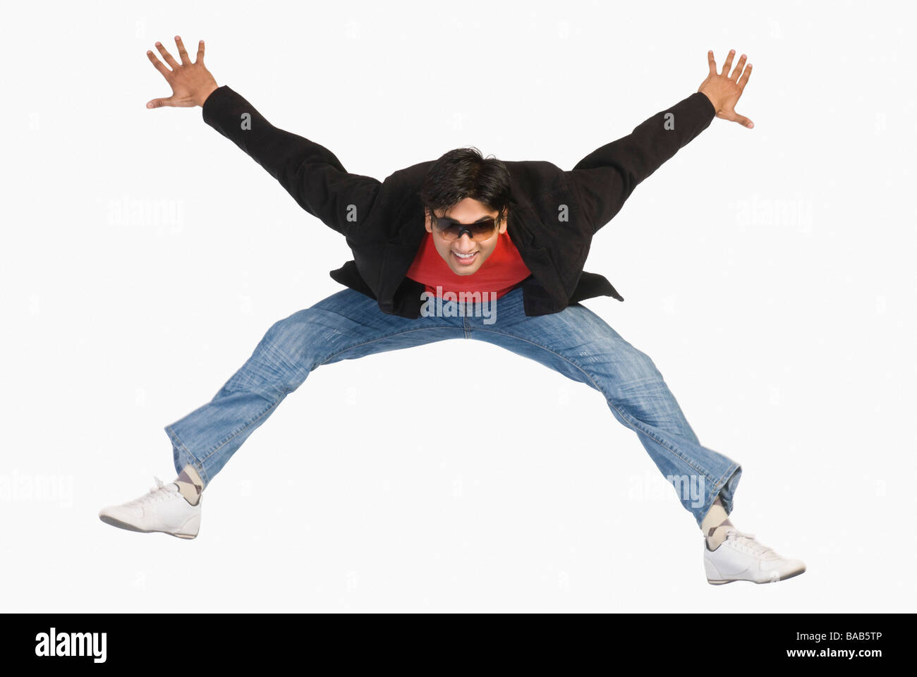 Man jumping in mid-air Stock Photo - Alamy