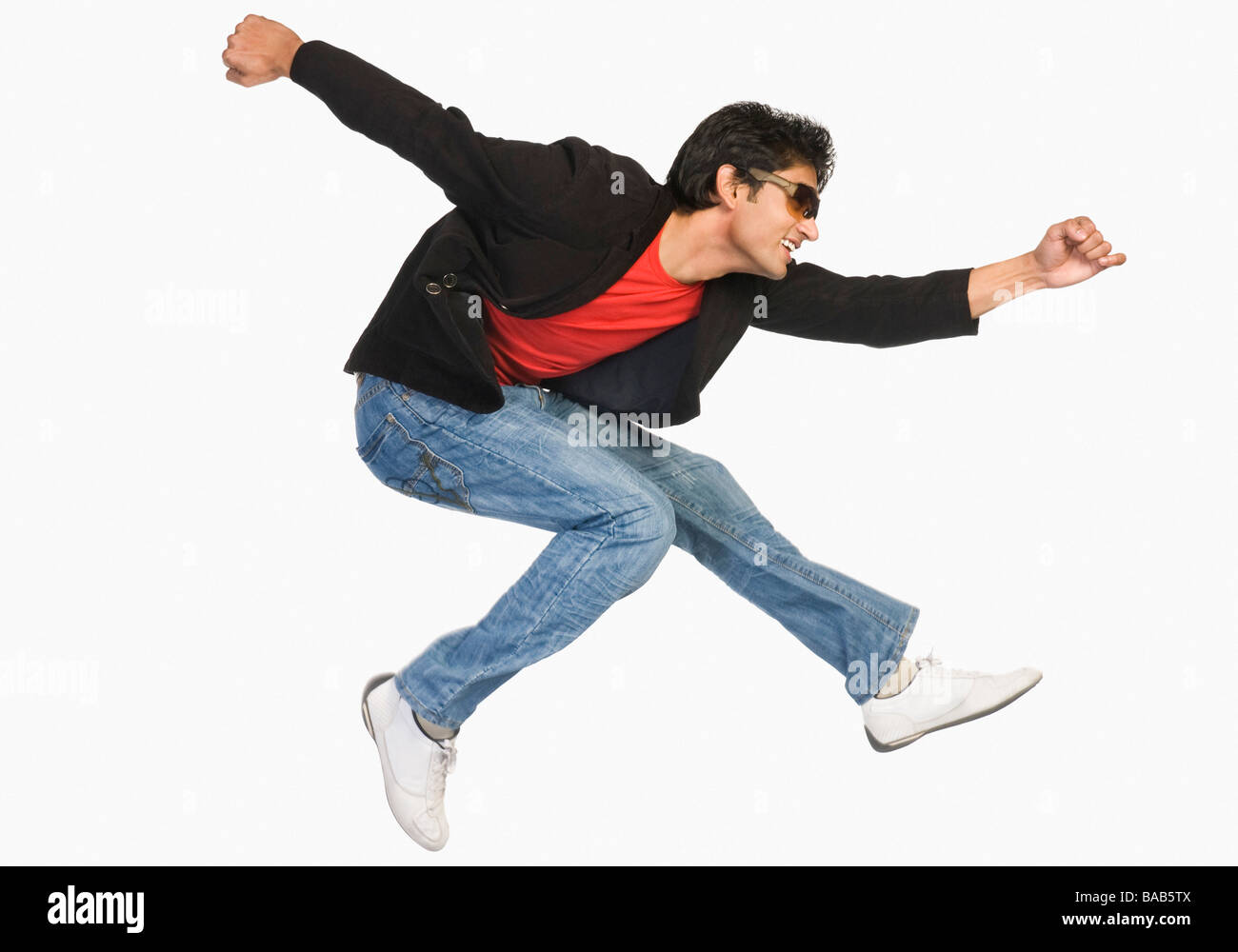 Man jumping in mid-air Stock Photo - Alamy