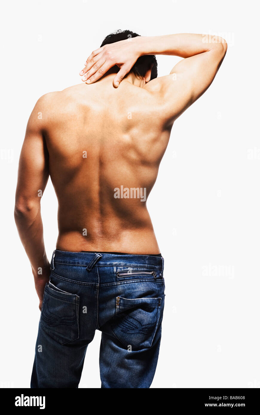 Rear view of a man stretching Stock Photo - Alamy