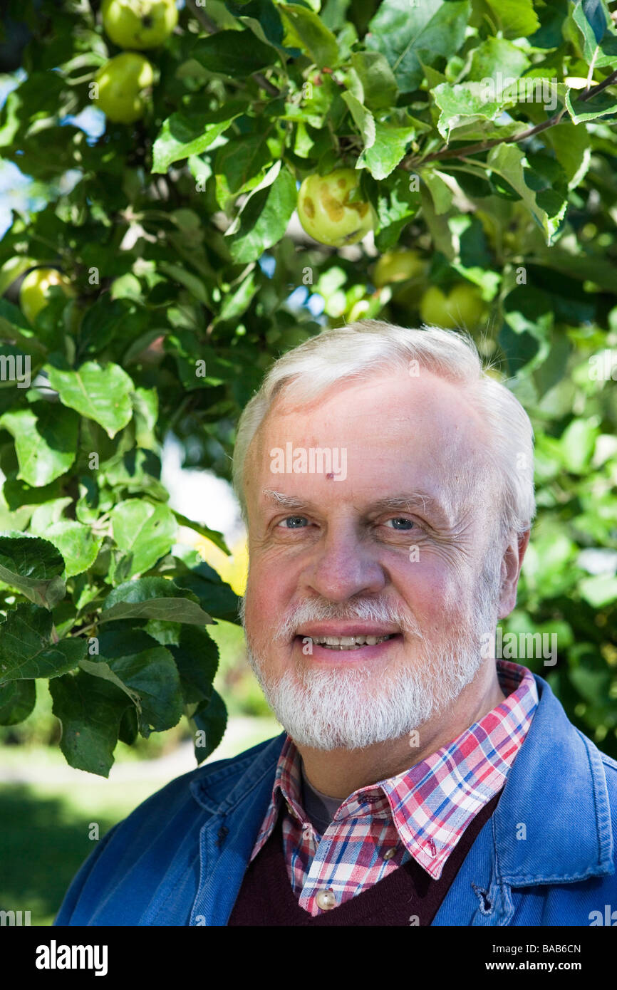 Portrait of a smiling man in a garden, Sweden Stock Photo - Alamy
