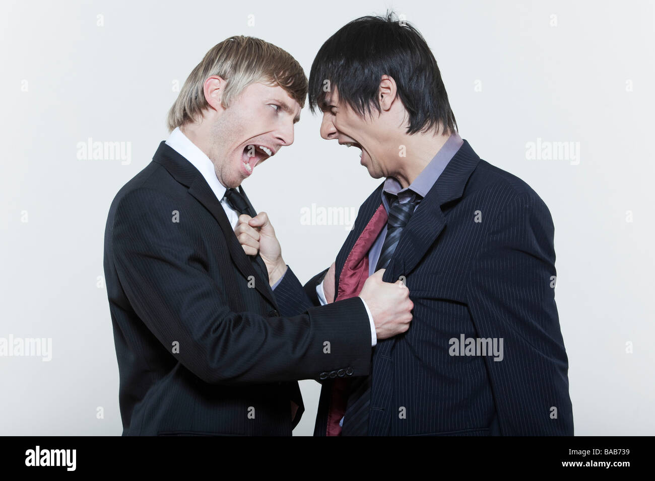 two male expressive young men on isolated background Stock Photo - Alamy
