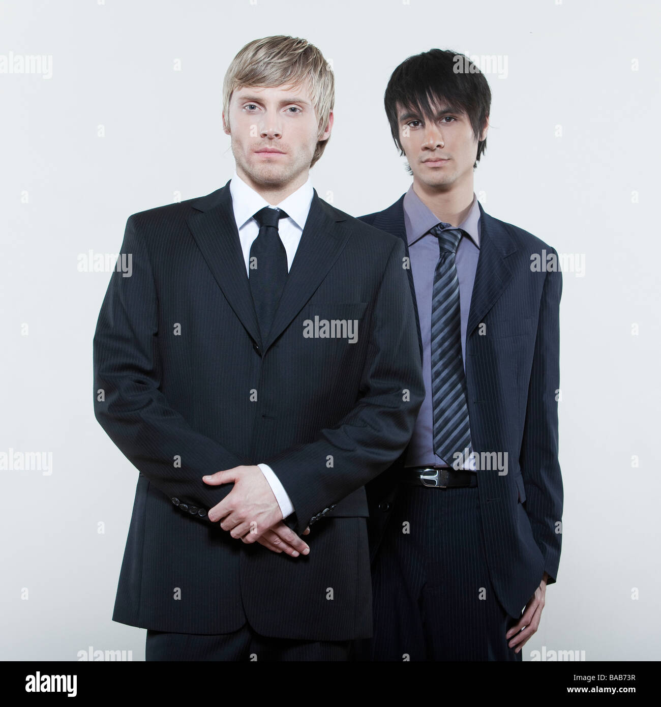 two male expressive young men on isolated background Stock Photo - Alamy