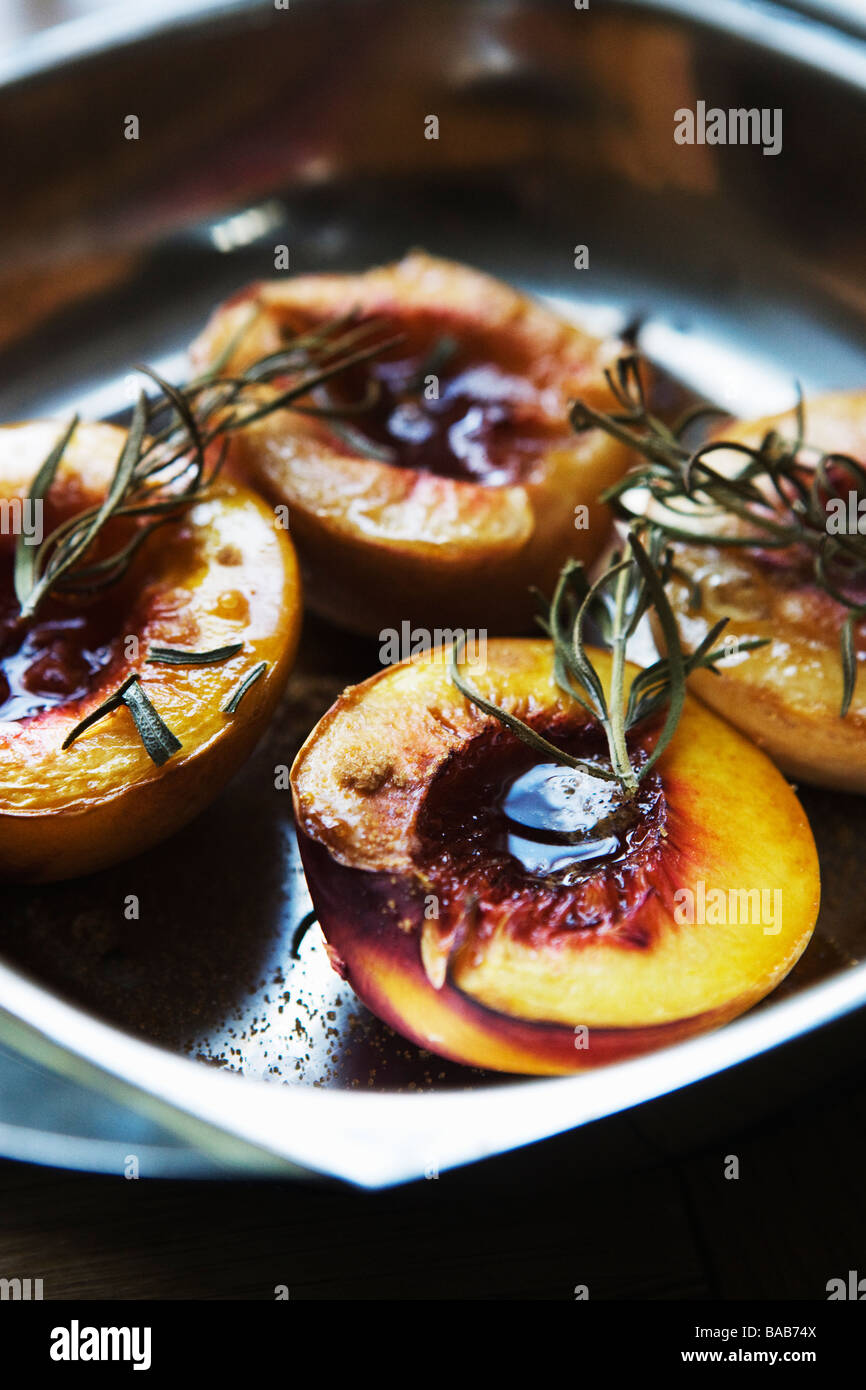 Peaches with rosemary in the owen, Sweden Stock Photo - Alamy