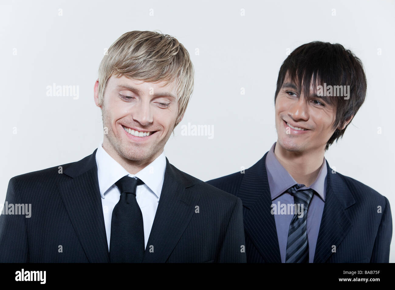 two male expressive young men on isolated background Stock Photo - Alamy