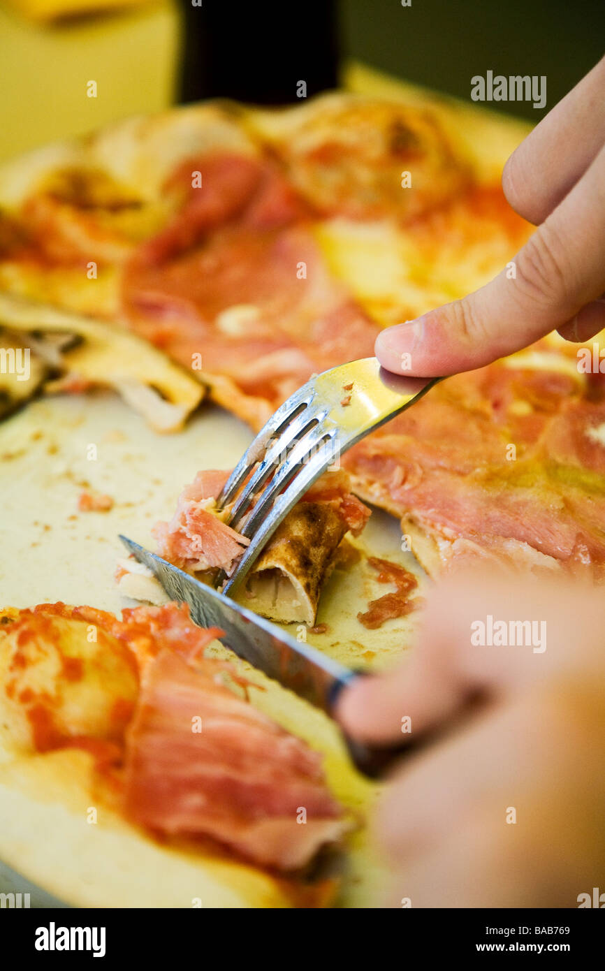 The Hands Of A Boy Eating Pizza Stock Photo - Alamy