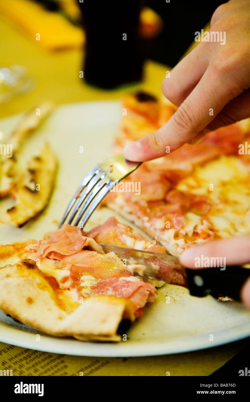 The Hands Of A Boy Eating Pizza Stock Photo - Alamy