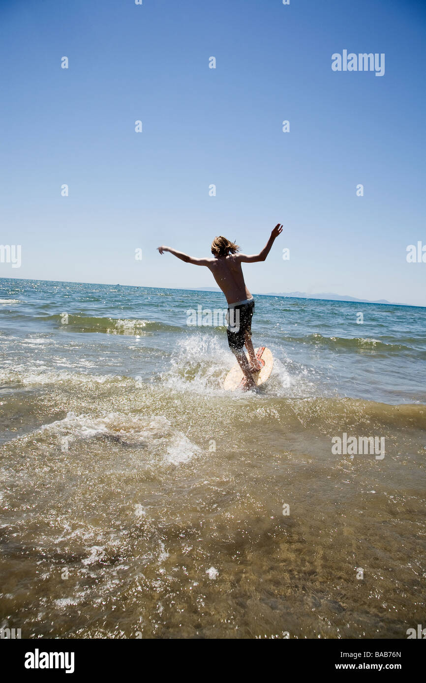 A Boy Playing On The Beach Toscana Italy Stock Photo - Alamy