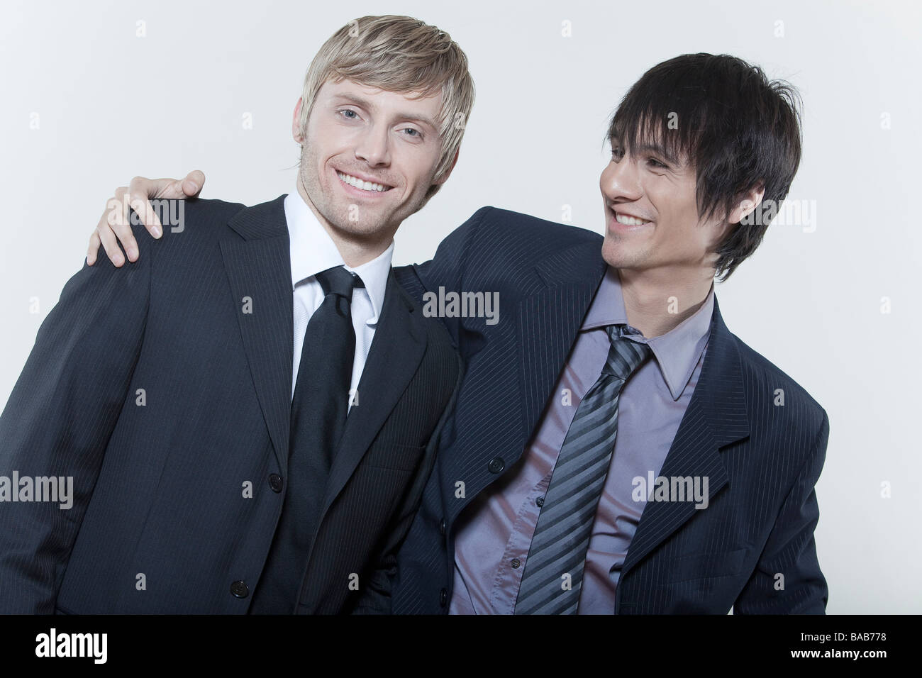 two male expressive young men on isolated background Stock Photo - Alamy