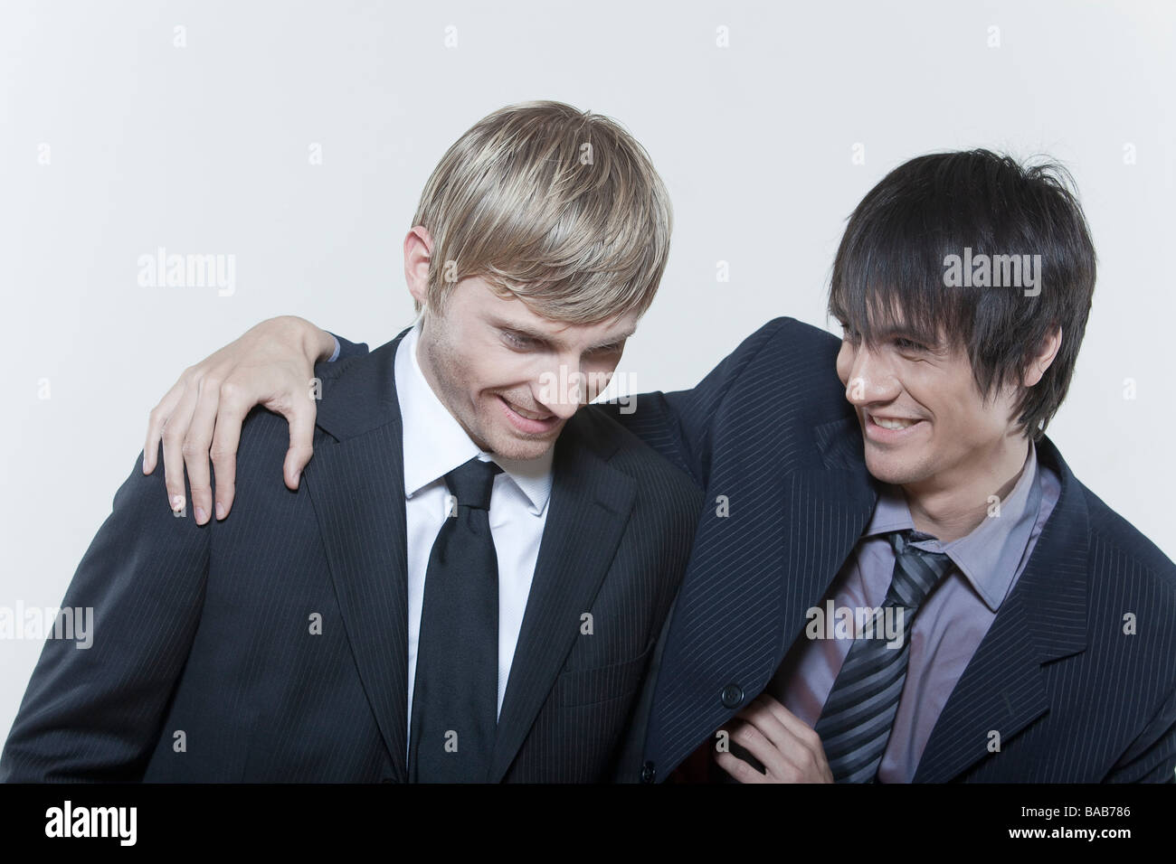 two male expressive young men on isolated background Stock Photo - Alamy