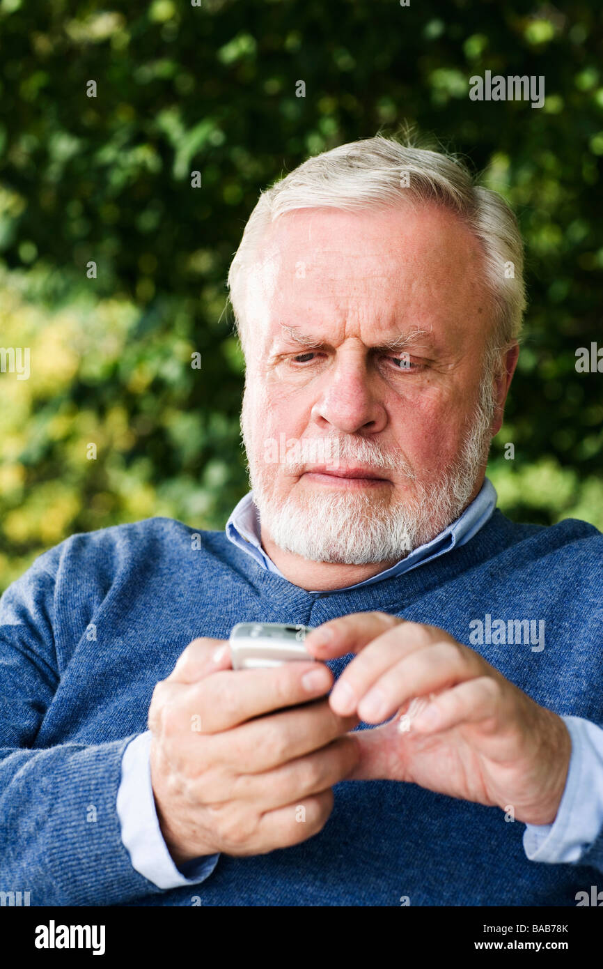 A man with a mobile phone, Sweden Stock Photo - Alamy