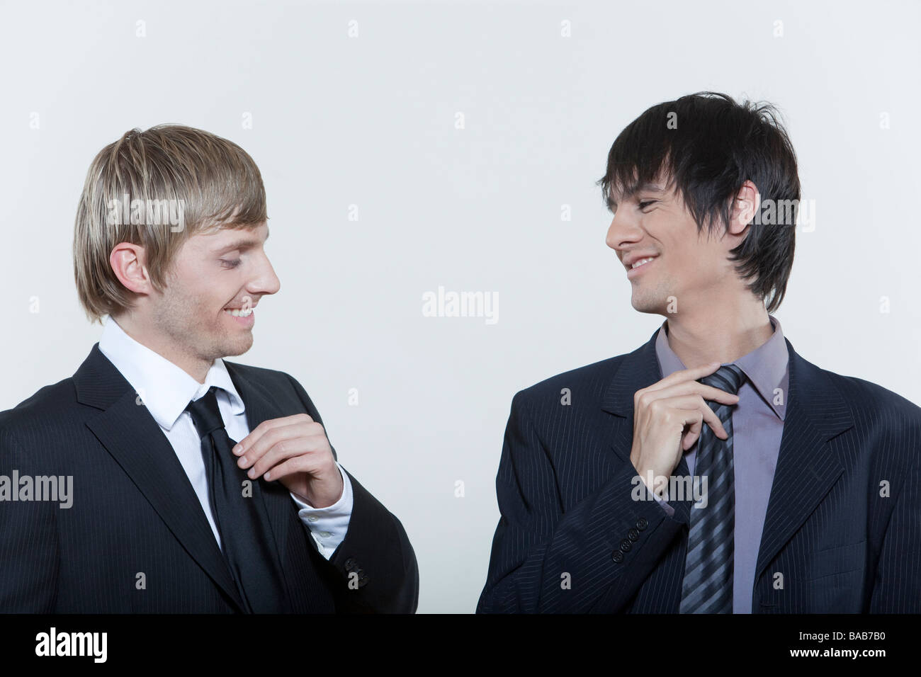 two male expressive young men on isolated background Stock Photo - Alamy