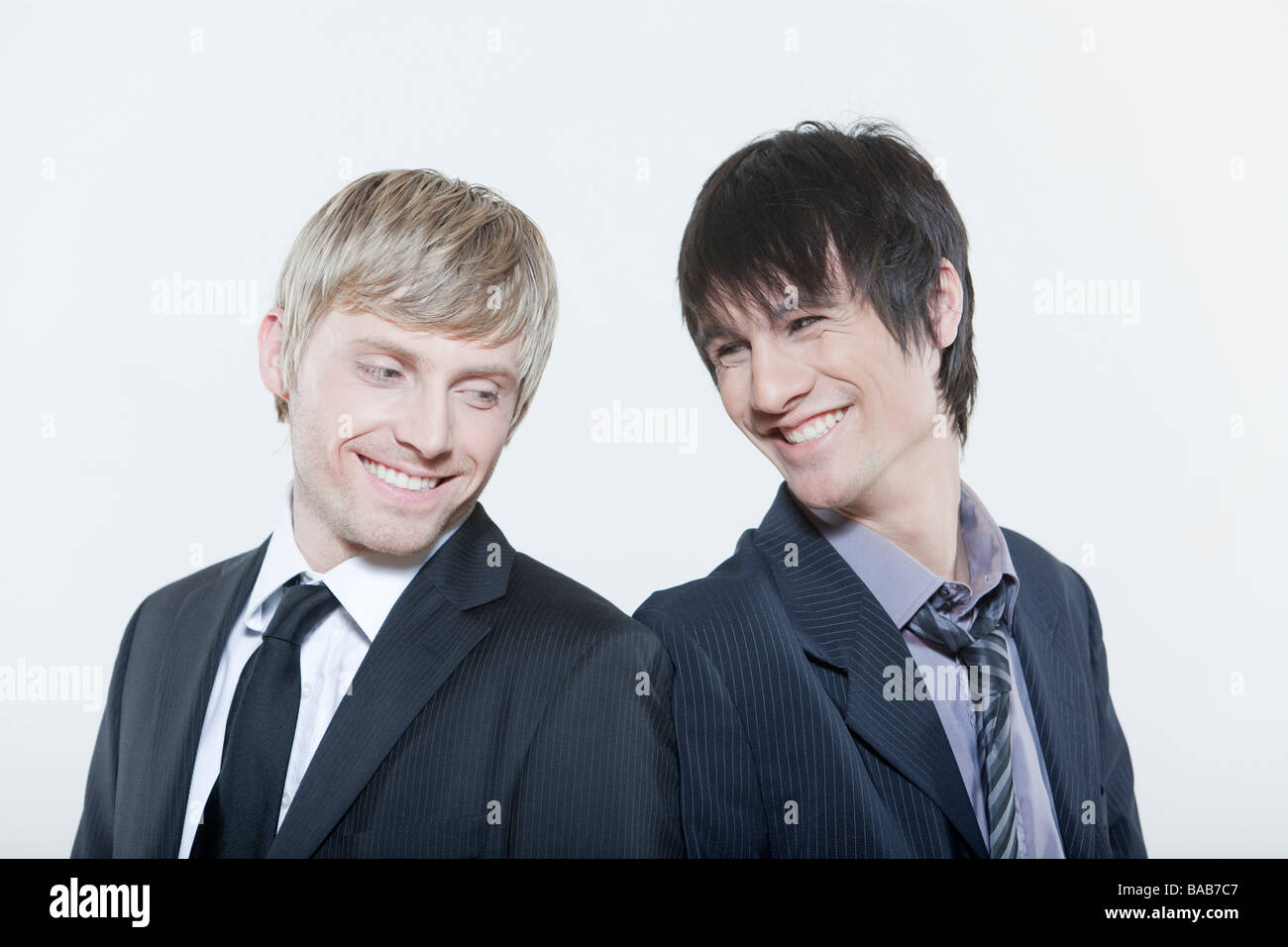 two male expressive young men on isolated background Stock Photo - Alamy