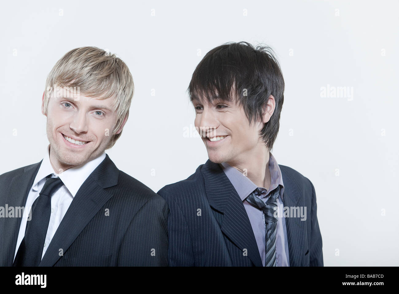 two male expressive young men on isolated background Stock Photo - Alamy