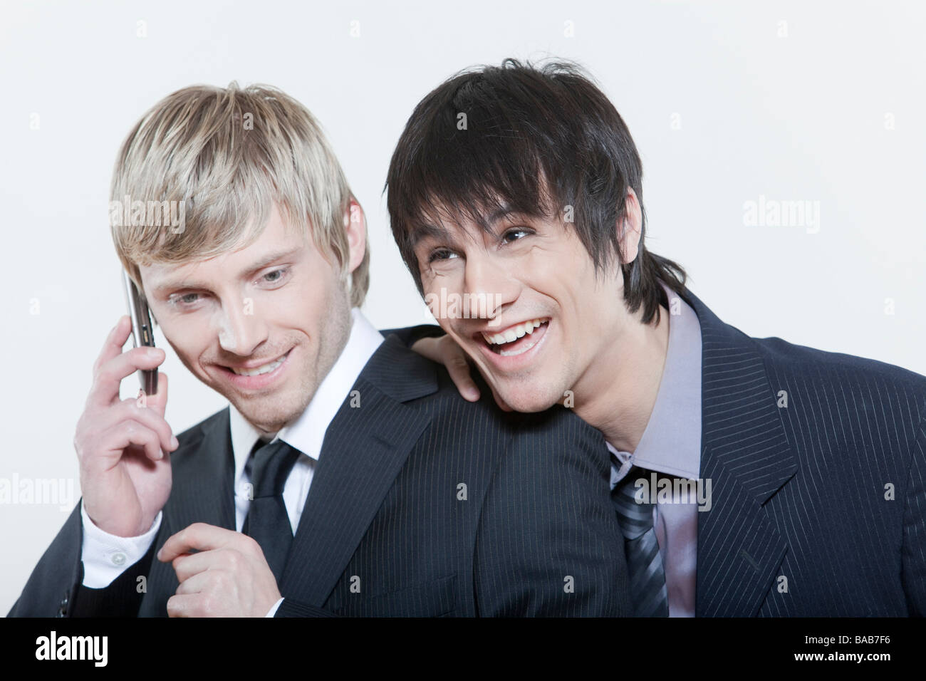 two male expressive young men on isolated background Stock Photo - Alamy