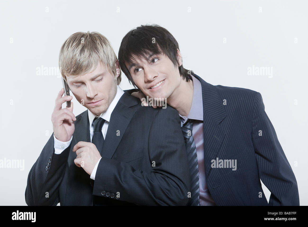 two male expressive young men on isolated background Stock Photo - Alamy