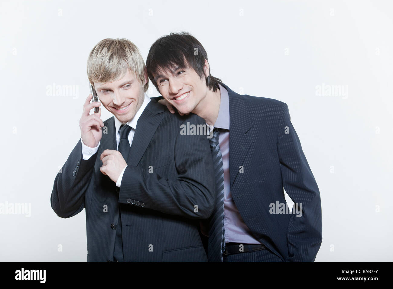 two male expressive young men on isolated background Stock Photo - Alamy