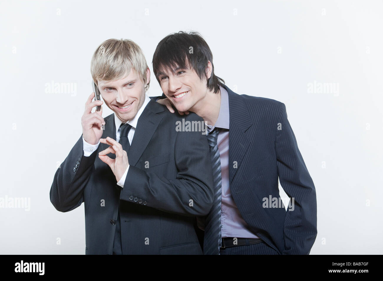 two male expressive young men on isolated background Stock Photo - Alamy